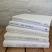 White Book Stack, White Shelf Aesthetic, White Themed Books, Ivory ...