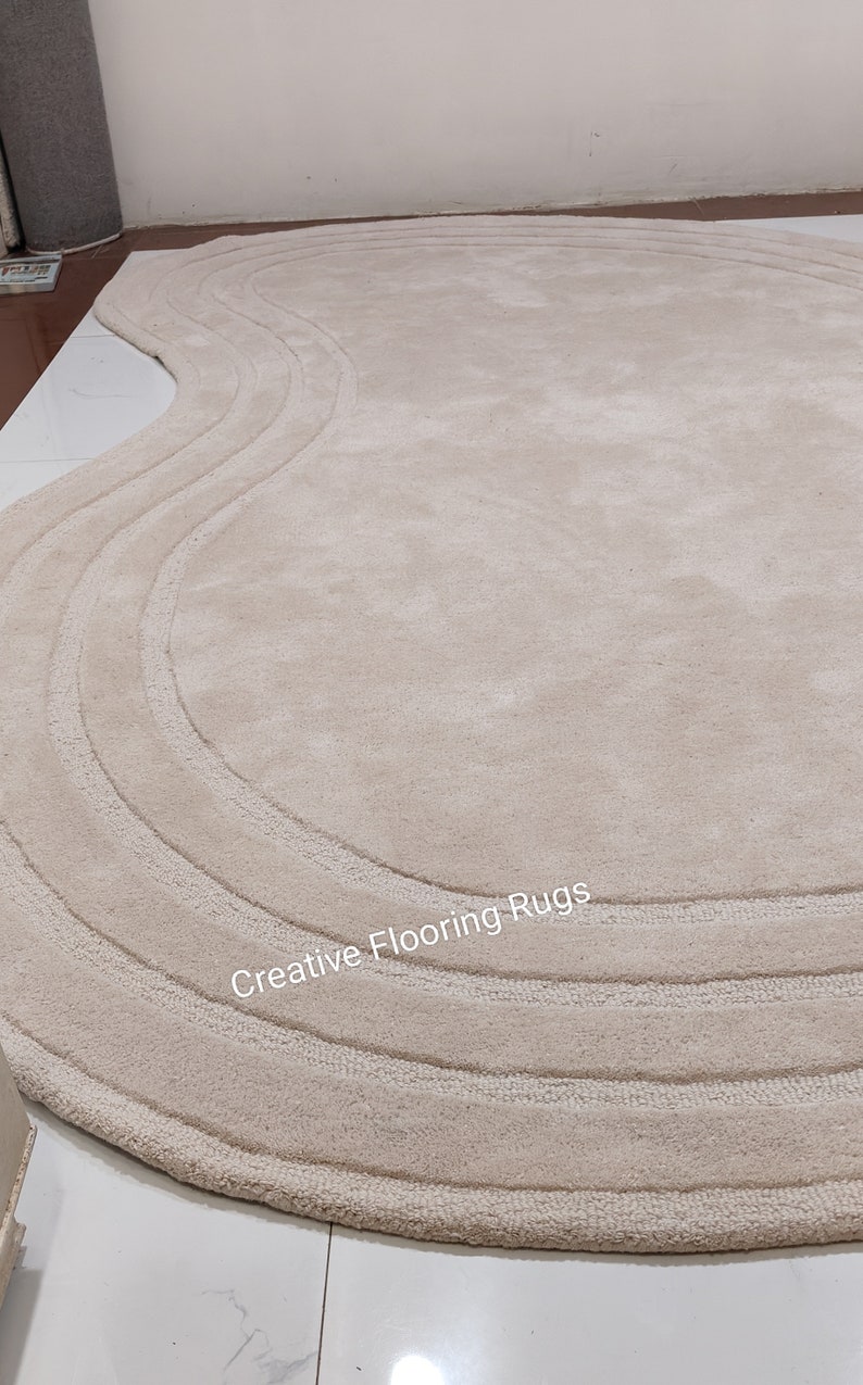 Solid Plain Ivory Kidney Shape Handmade Woolen Tuffted Carpet Premium ...