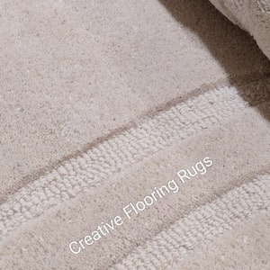 Solid Plain Ivory Kidney Shape Handmade Woolen Tuffted Carpet Premium ...