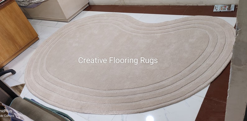 Solid Plain Ivory Kidney Shape Handmade Woolen Tuffted Carpet Premium ...