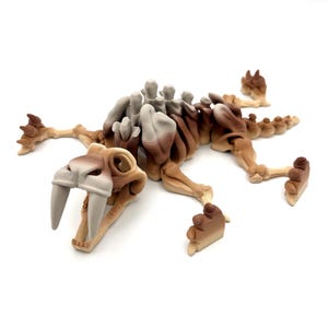 3D Printed Articulated Sabertooth Tiger Skeleton: Jurassic World Desk ...