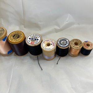 Timeless Treasures: Vintage Thread Set - 7 Spools on Antique Wooden ...