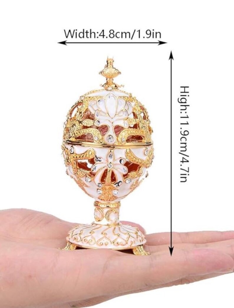 Faberge Replica Type Egg With Cut Outs and Swan Trinket in the Middle ...
