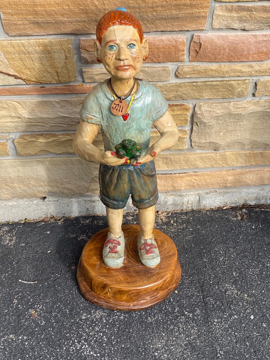 Chainsaw Carved Little Red Head Sculpture Showing off Her Frog. Named ...