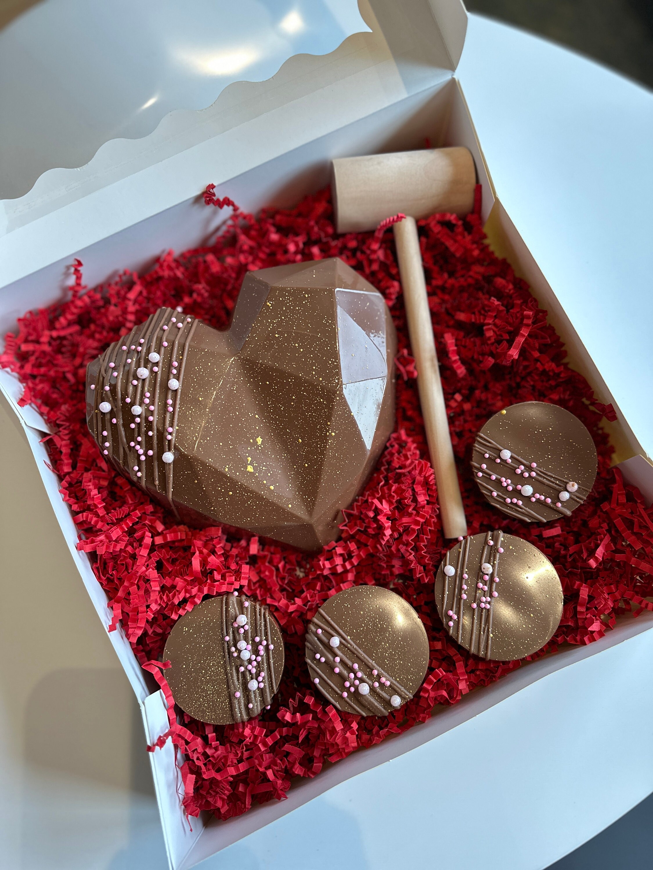 Smashable chocolate heart with hammer store