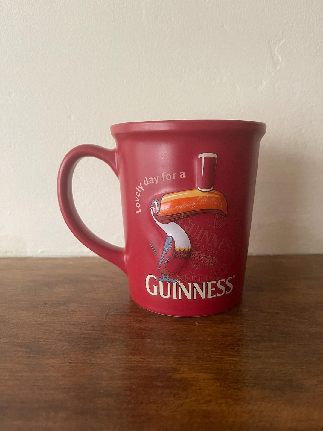 GUINNESS TOUCAN MUG Red Iconic Irish Stout Ceramic Cup Lovely Day for a ...