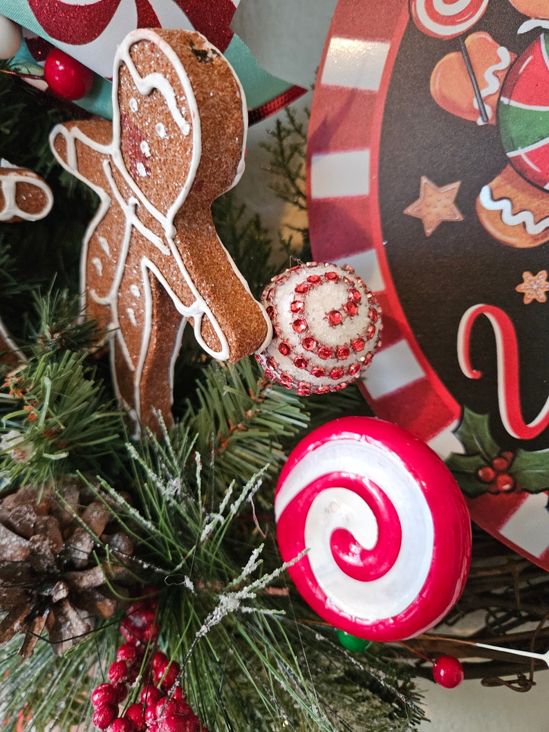 Christmas Wreath With Gingerbread Cookies Welcome Sign and Peppermints ...