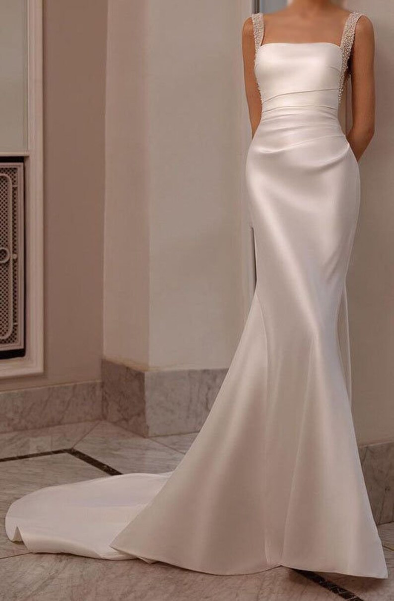 Elegant Fish Wedding Dress With Embroidered Lace at Edges of a Sweep ...