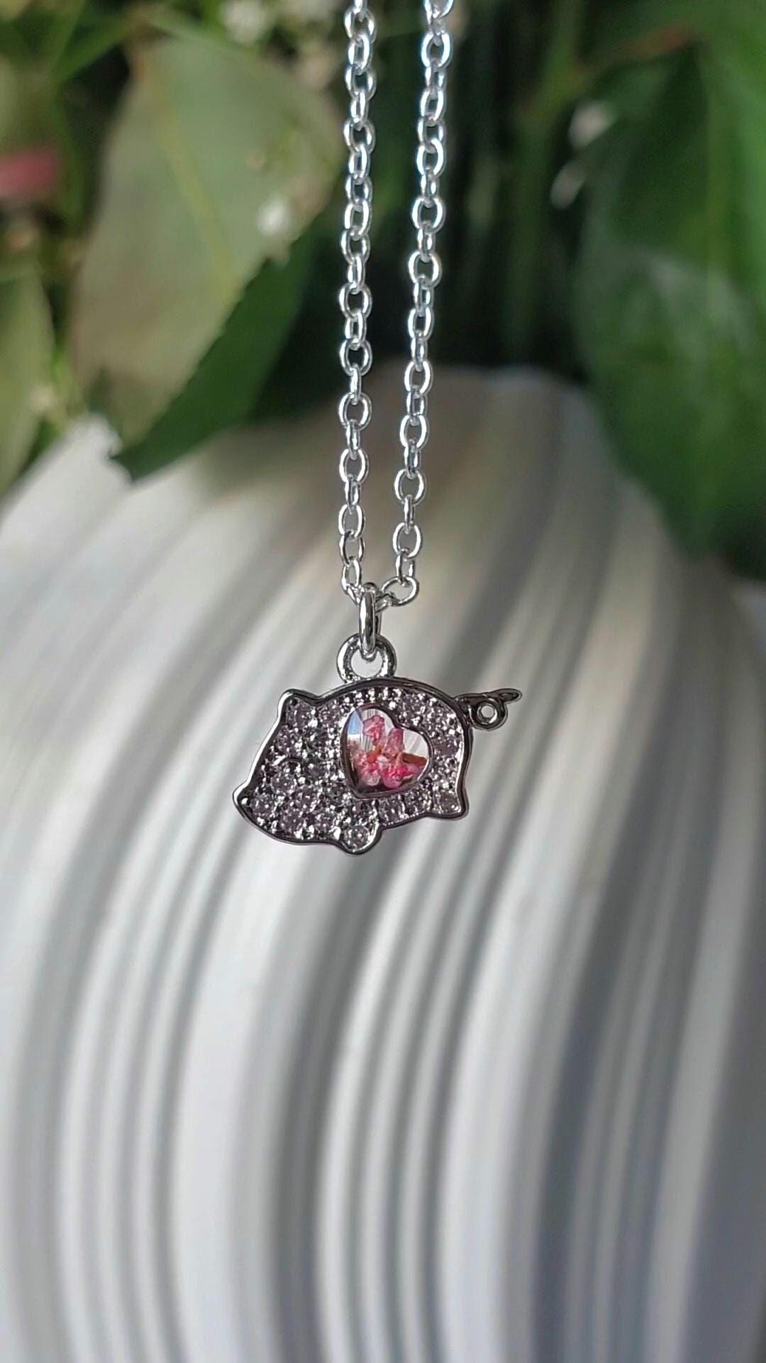 Tiny Cubic Zirconia Pig Necklace With A Pressed Pink Flower Middle ...
