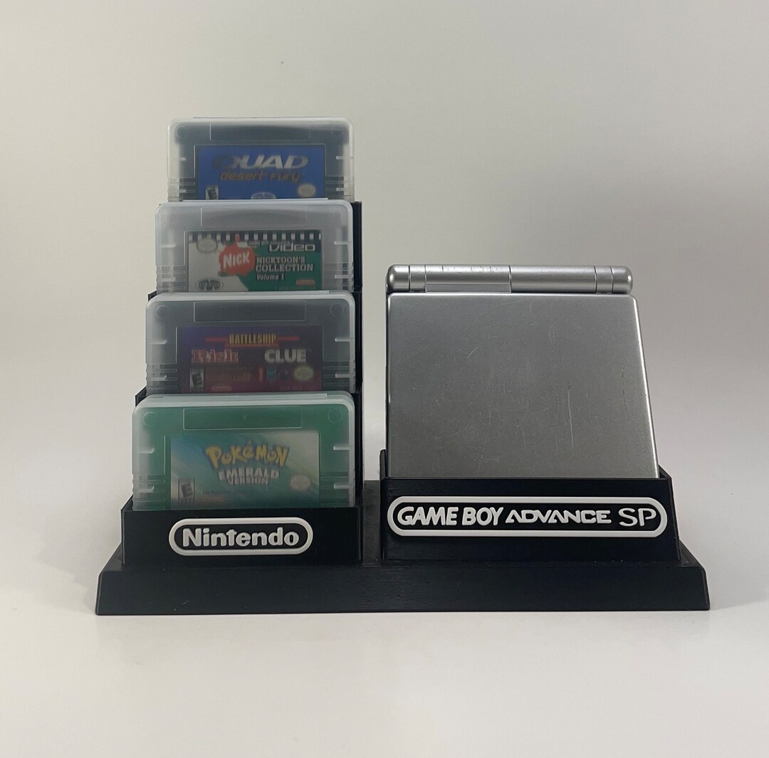 Nintendo Game Boy Advance SP and 8 Games in Protective Cases Stand ...