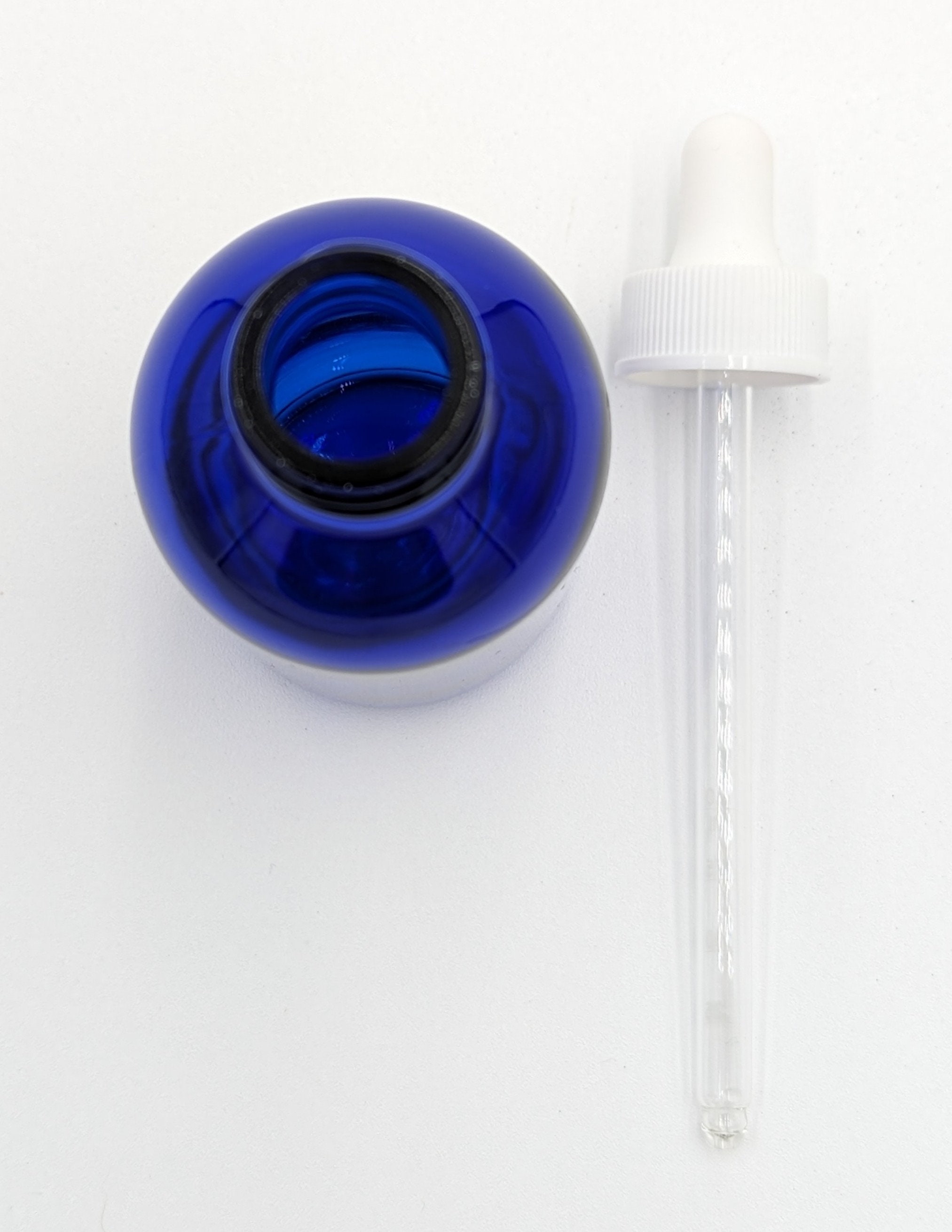 Craft Bottle Cobalt Blue Glass Bottle With White Bulb Glass Metered ...