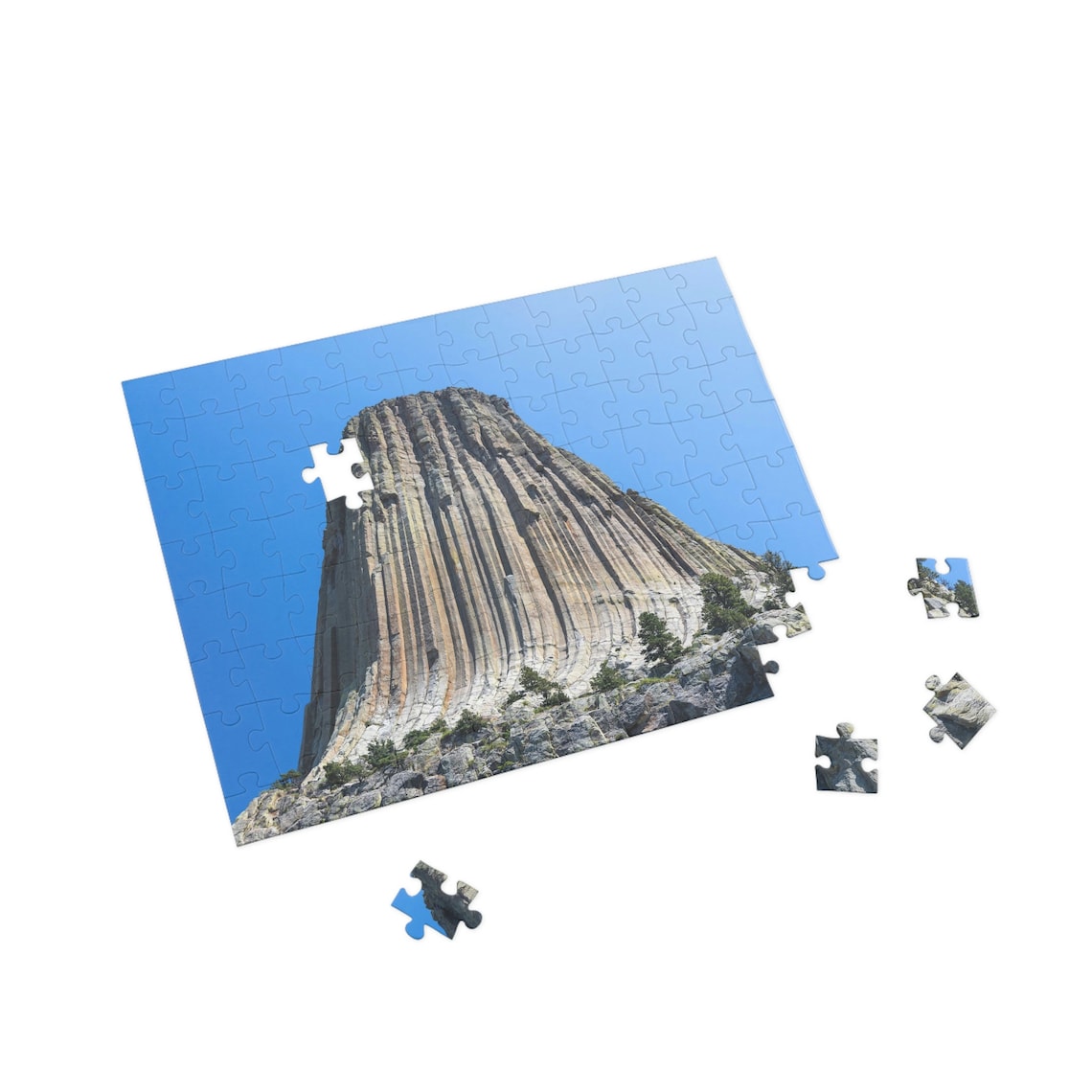 The Majestic Devils Tower: A Clear Day's View of the Monolith Rising Towards the Blue Sky Puzzle ...
