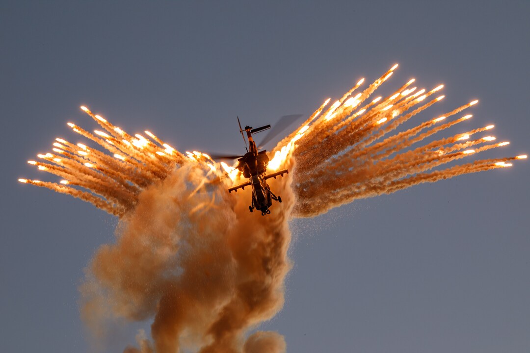 Angel Wings, Formed as the Rooivalk Attack Helicopter Fires Its Flares ...