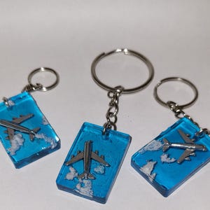 Handmade Epoxy Resin Keychain With Airplane Flying Through Clouds ...