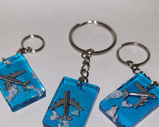 Handmade Epoxy Resin Keychain With Airplane Flying Through Clouds ...