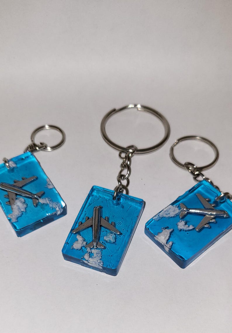 Handmade Epoxy Resin Keychain With Airplane Flying Through Clouds ...