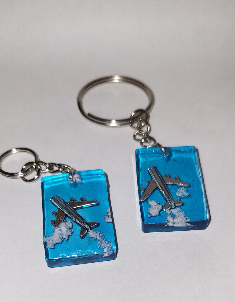 Handmade Epoxy Resin Keychain With Airplane Flying Through Clouds ...