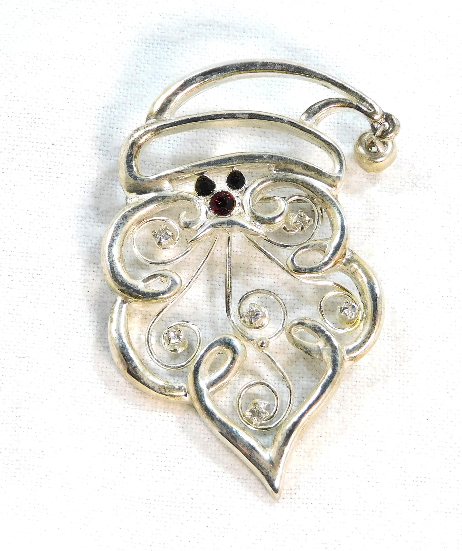 Vintage Santa Claus Head Pin Silver Toned Metal Red Rhinestone Eyes ...