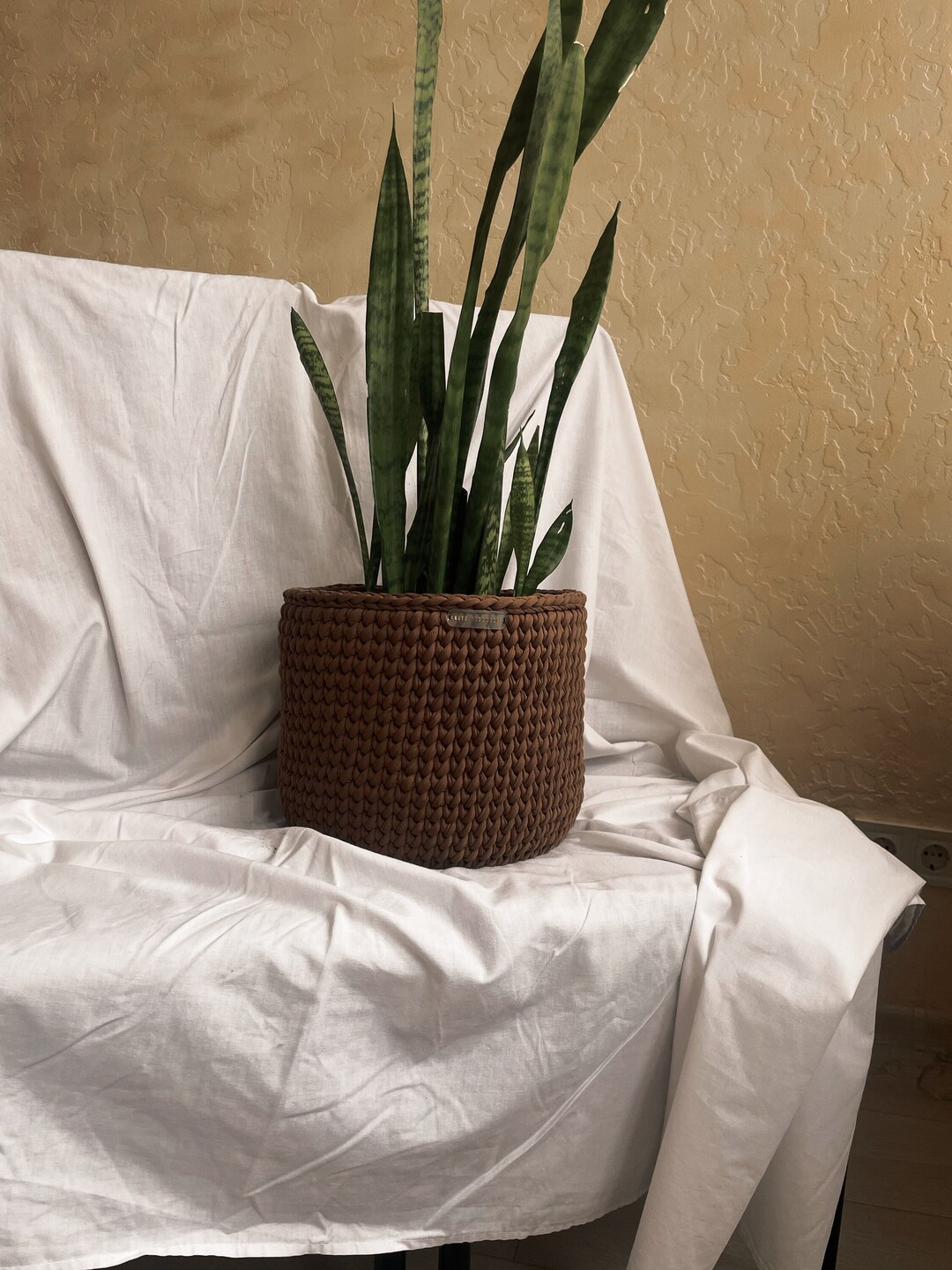 Big Decorative Flower and Plant Pot Made of Knitted Yarn on a Wooden ...