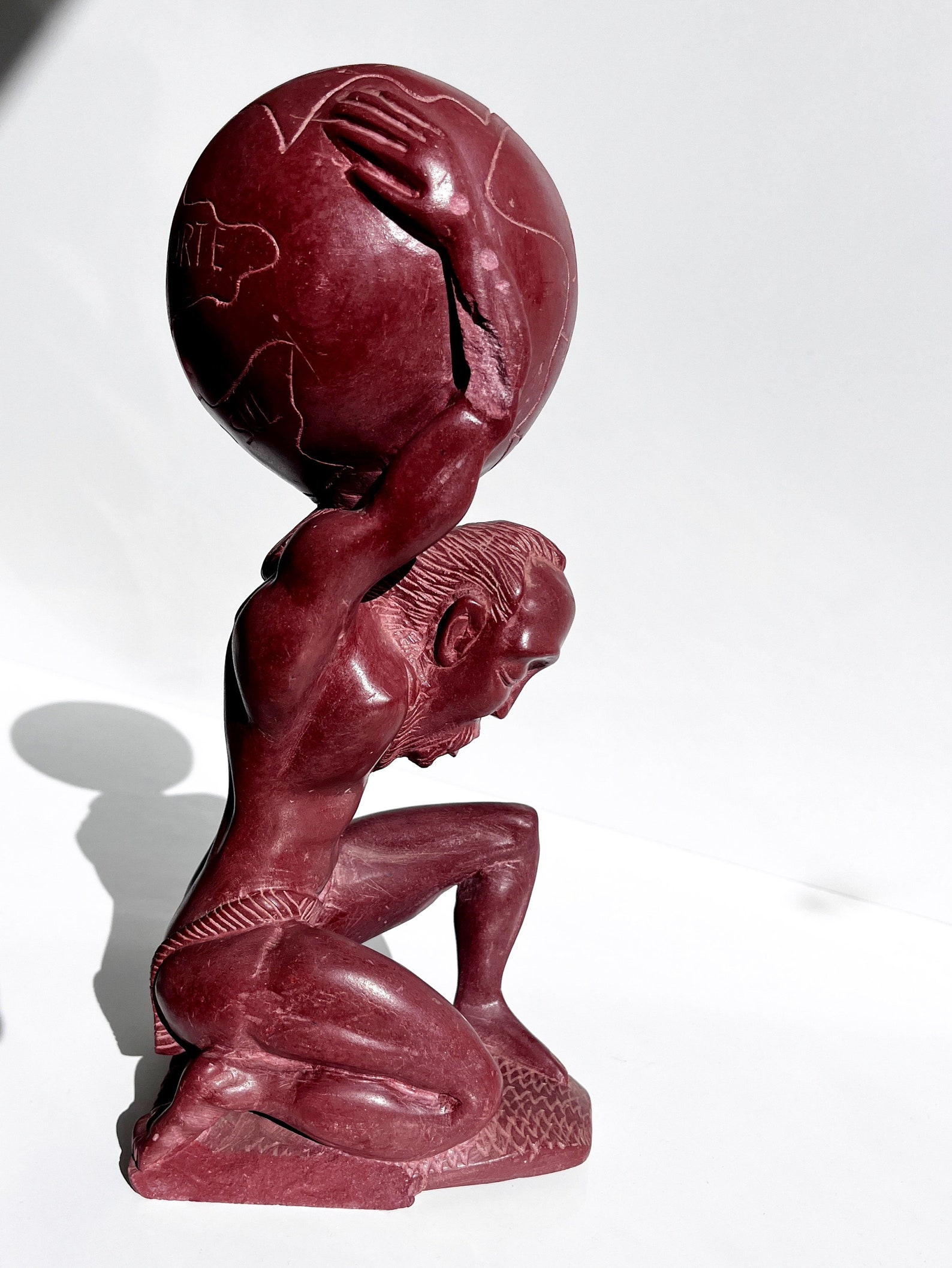 Sculpture of the Greek God Atlas Made of Red Stone. Africa Natural ...