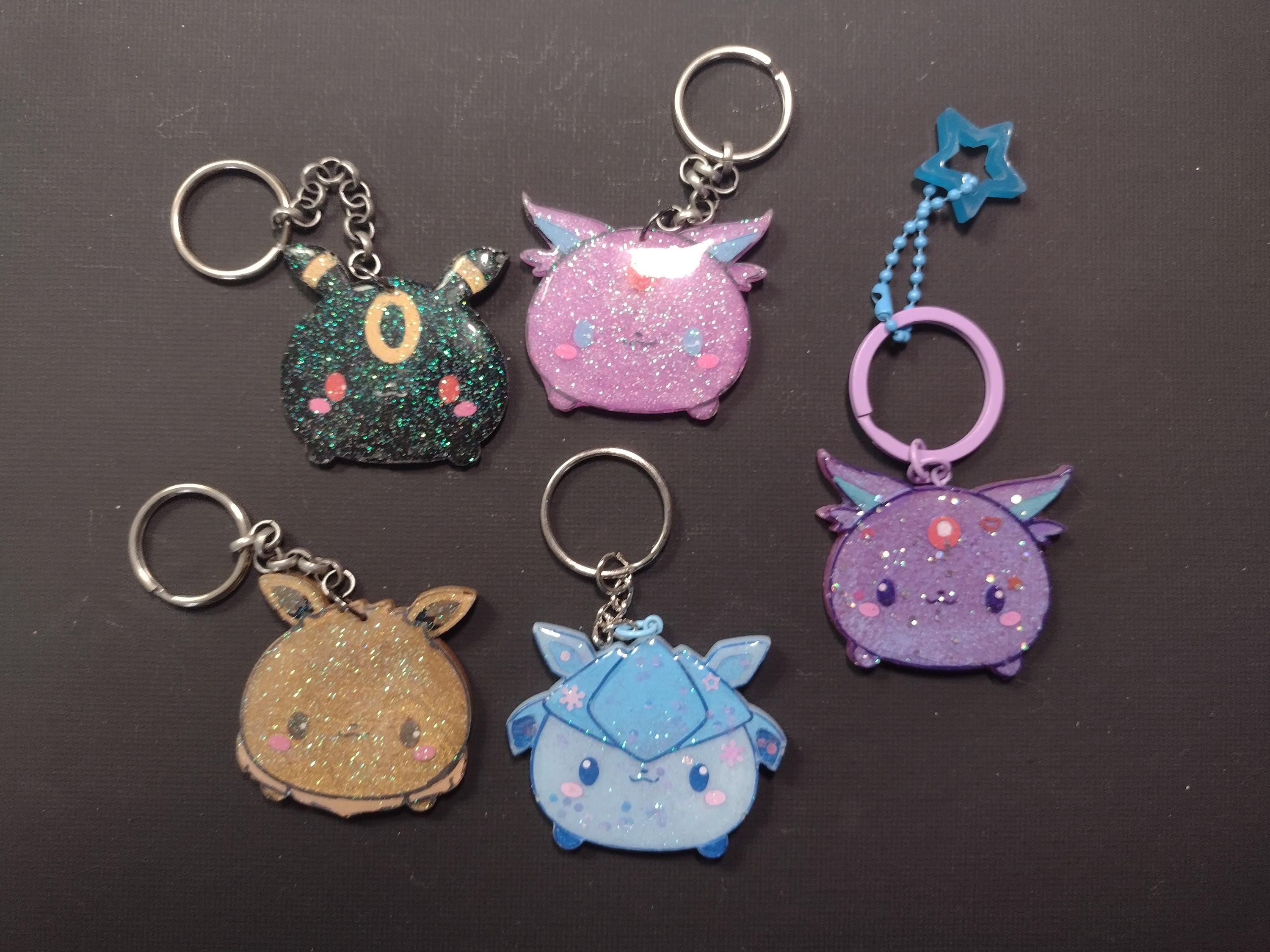 Eeveelution Pocket Monster Keychains, Phone Grips, and Badge Reels ...