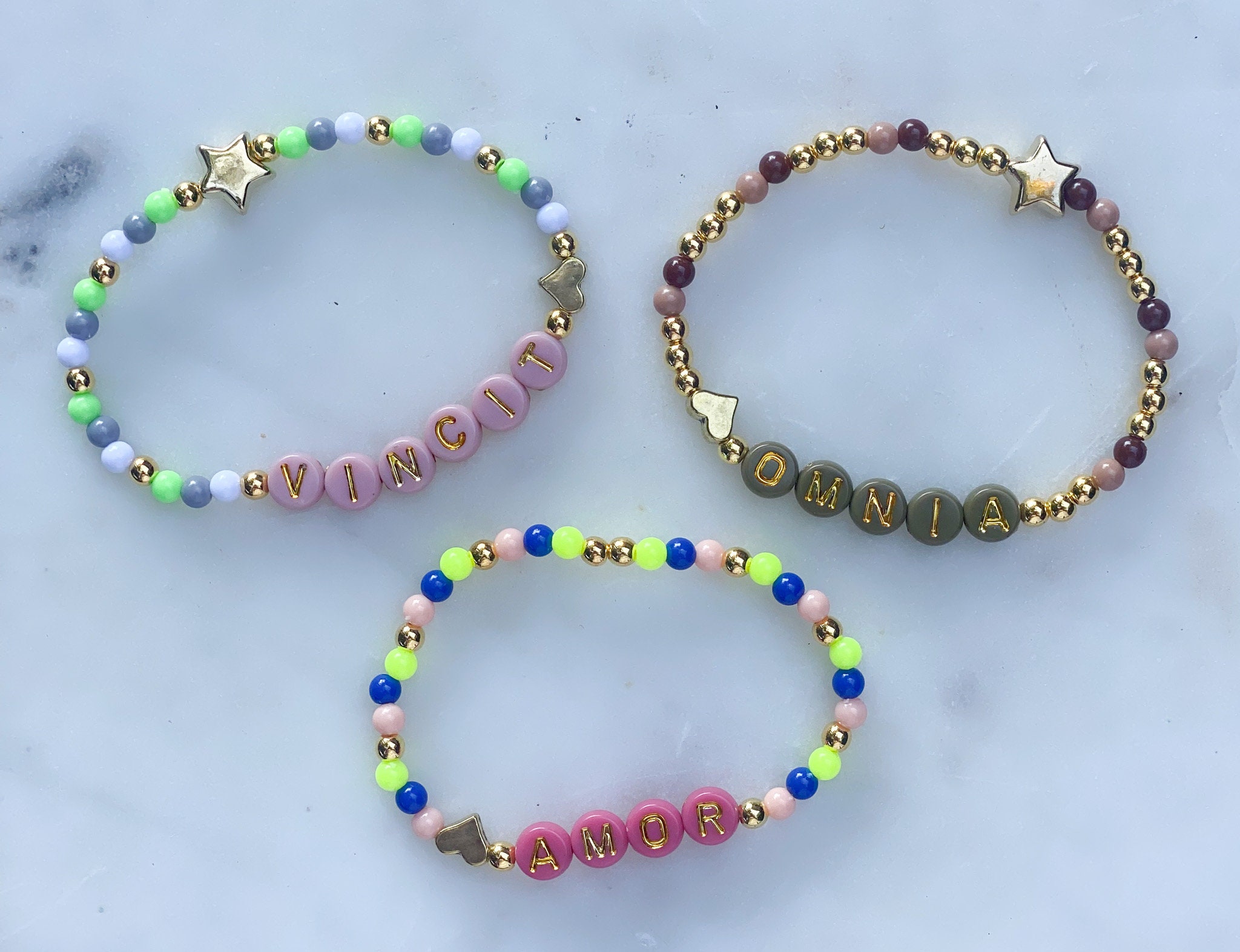 Amor Vincit Omnia Set of 3 Stacking Beaded Stretch Bracelets, Latin for ...