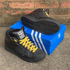 Vintage Adidas Shell Toe Mid-tops, Black Adidas Sneakers, Yellow Laces ...