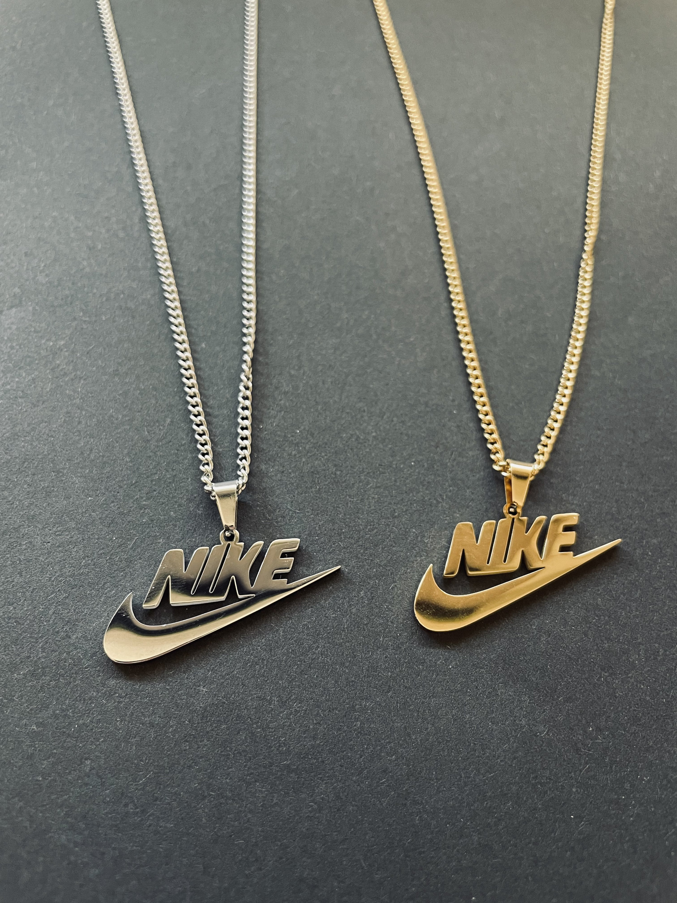 Gold Nike Swoosh Logo