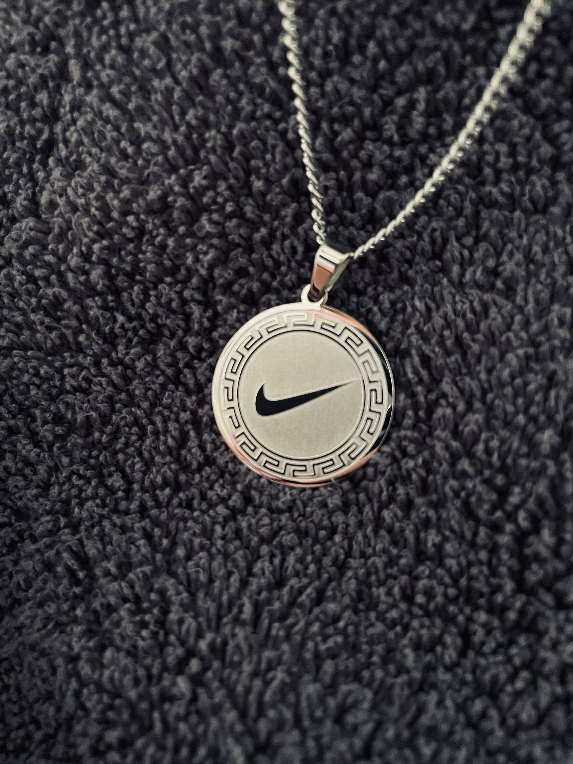 Nike swoosh necklace silver store