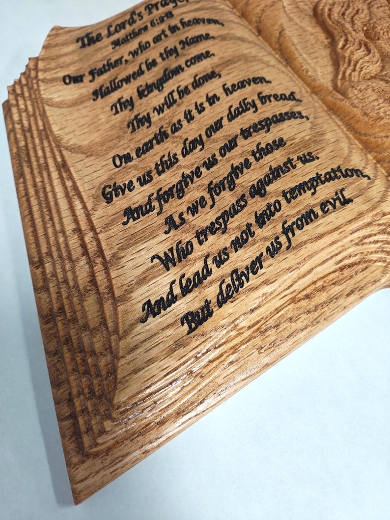 Carved Bible of the Lord's Prayer on Left, Silhouette of Christ on ...