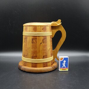 Vintage Large Segmented Wooden Beer Mug on a Wooden Coasters. Beautiful ...