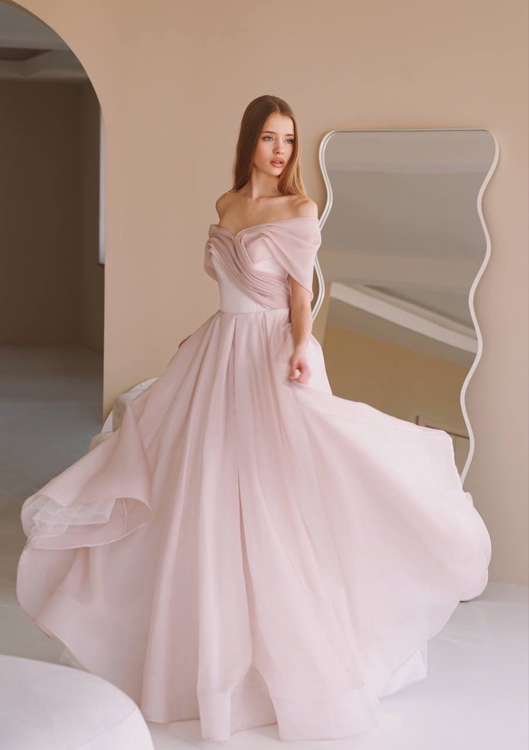 An Elegant Wedding Dress With Sheer Drop Sleeves and a Soft Powdery Hue ...