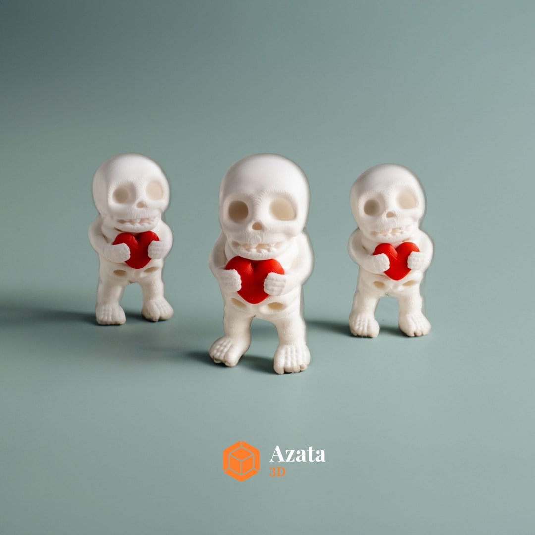 Articulated Tiny Skeleton Hording a Heart Keychain | Skull Fidget Toy ...