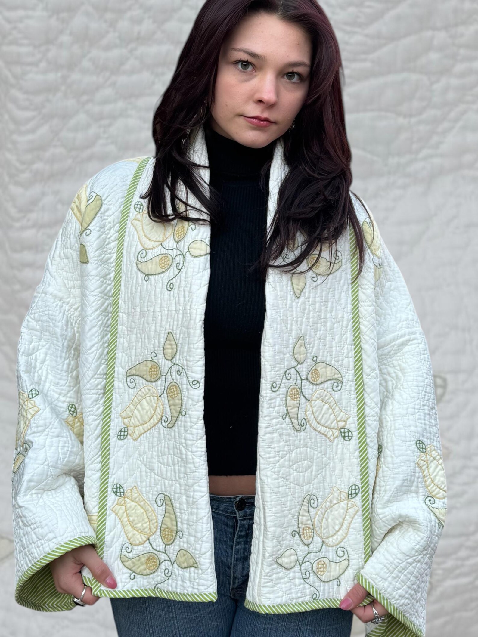 Handmade Quilted Jacket With Flower Appliques Against an Ivory ...
