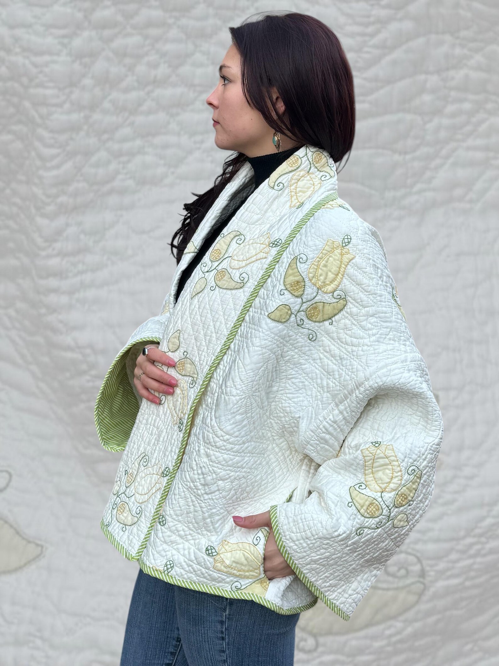 Handmade Quilted Jacket With Flower Appliques Against an Ivory ...