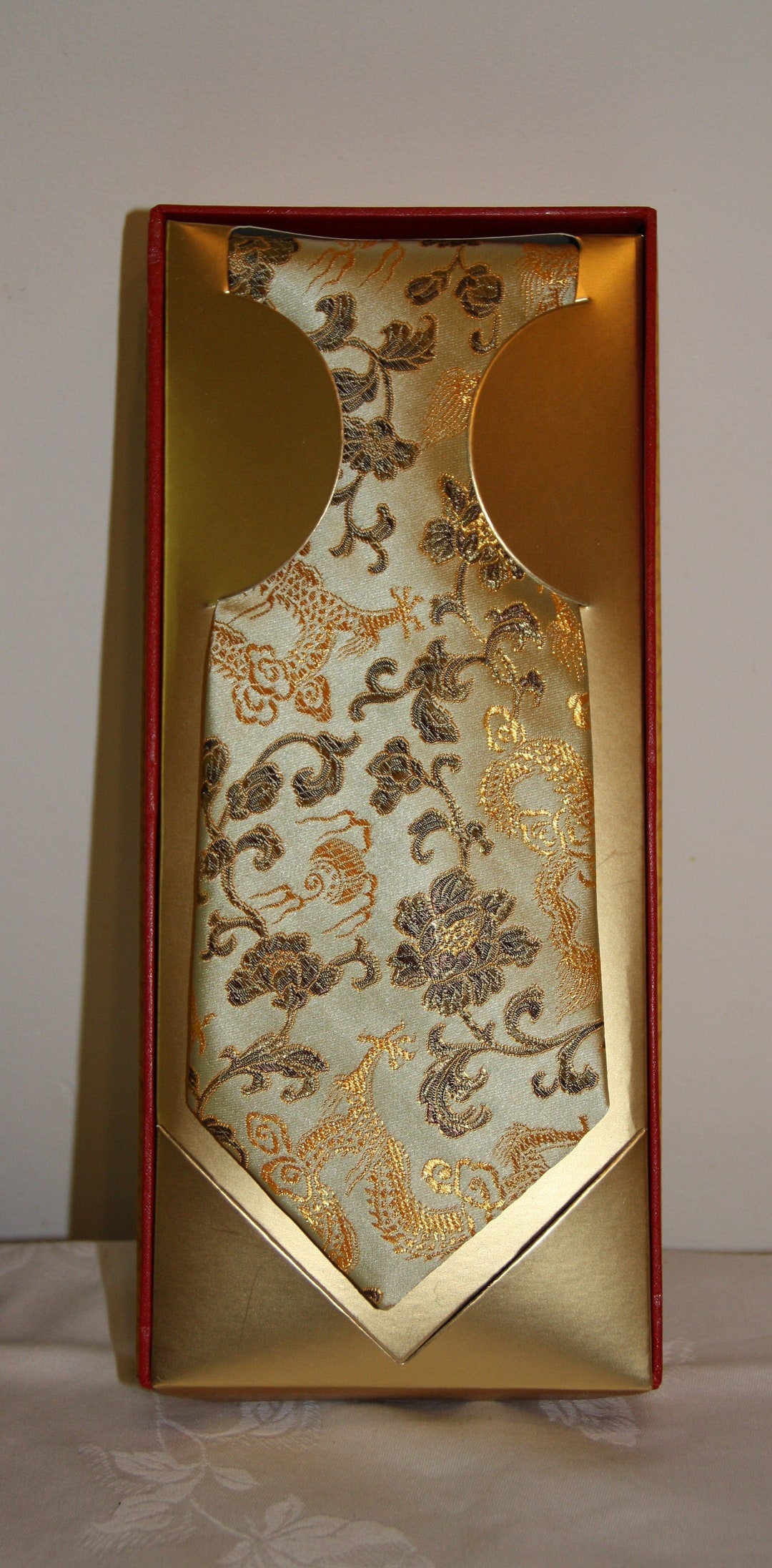 An Elegant Brocade Necktie With Gorgeous Floral and Dragon Design, a ...