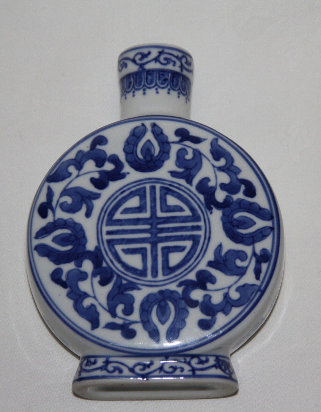 A Blue and White Chinese Moon Flask With Traditional Symbols and Flower ...