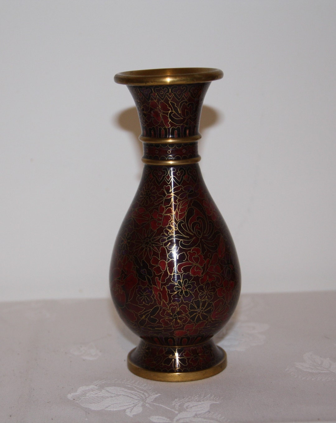 A Dark Red Cloisonne Vase With Floral Pattern, an Oriental Vase With ...