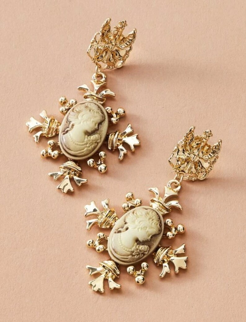 Gold Embossed Figure Drop Earrings - Etsy