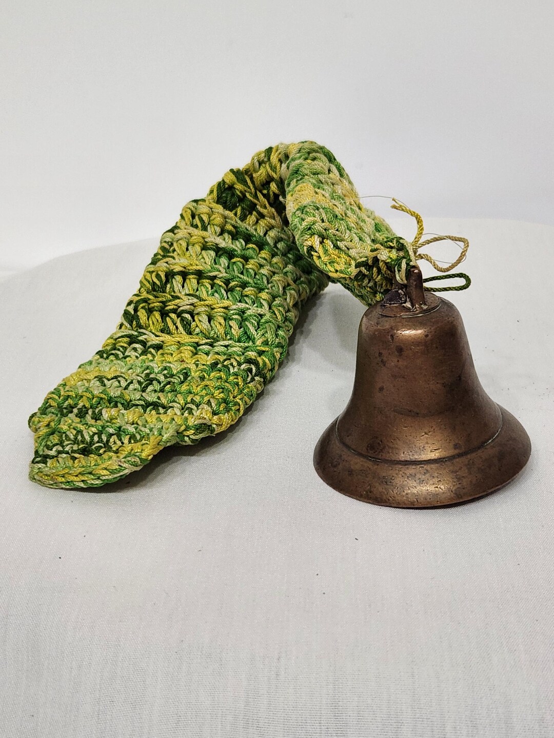 Solid Bronze Bell Hanging From Hand Crocheted Variegated Green Hanger ...