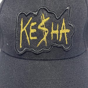 Kesha - Name/logo - Gold & Black Baseball Hat - Adjustable Velcro Back ...