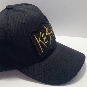 Kesha - Name/logo - Gold & Black Baseball Hat - Adjustable Velcro Back ...