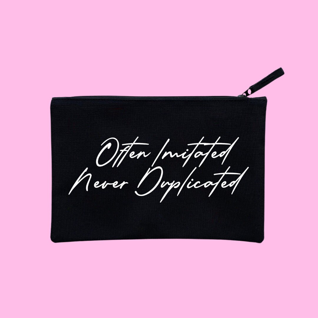 Black Slogan Pouch - 'often Imitated Never Duplicated' Pouch - Makeup ...
