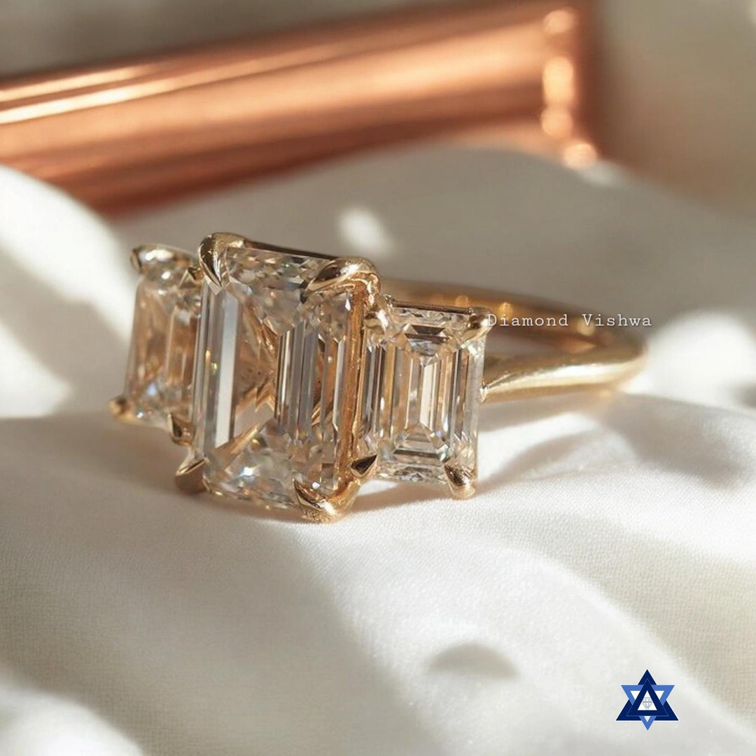 Emerald Cut Moissanite Trilogy Ring With Emerald Side Stones – Trinity ...