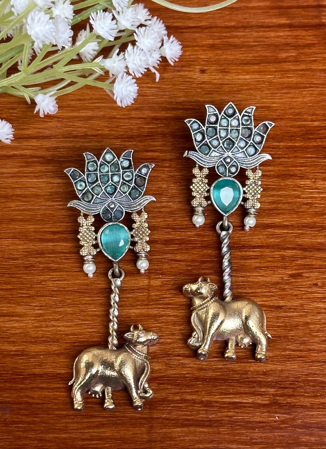 MOHINI Sky Blue Antique Dual Tone Animal Motif Dangler Earrings Brass ...