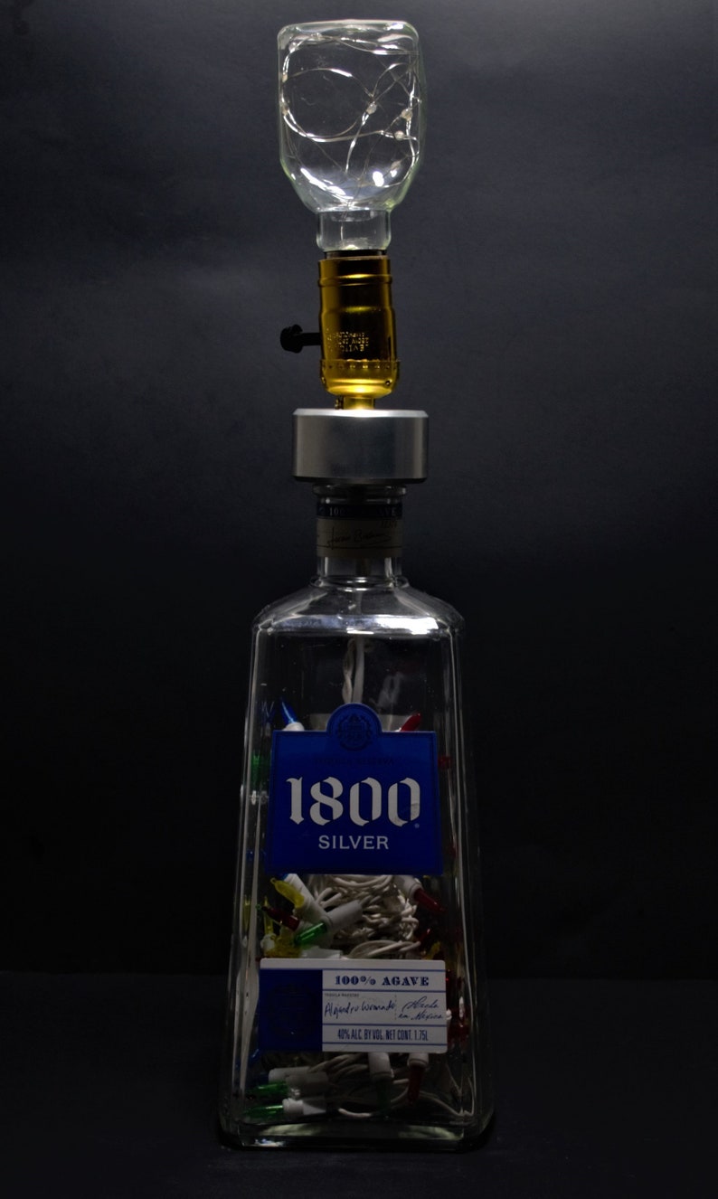 1800 Tequila 1.75-liter Upcycled Lamp. Multicolored String Lights Fill ...
