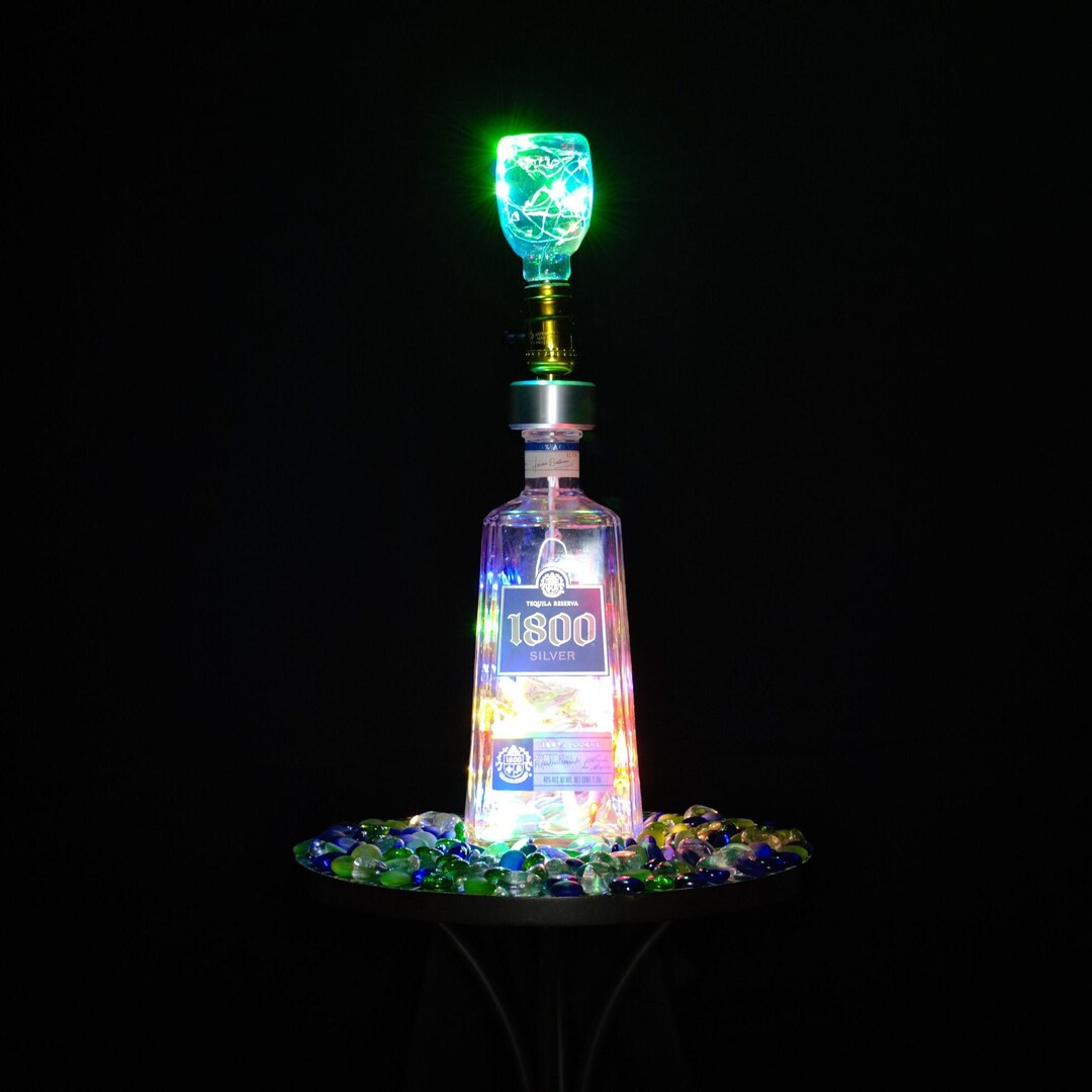 1800 Tequila 1.75-liter Upcycled Lamp. Multicolored String Lights Fill ...