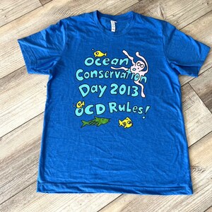 New Girl Ocean Conservation Day 2013 T-shirt- OCD Rules- Jessica Day - Etsy
