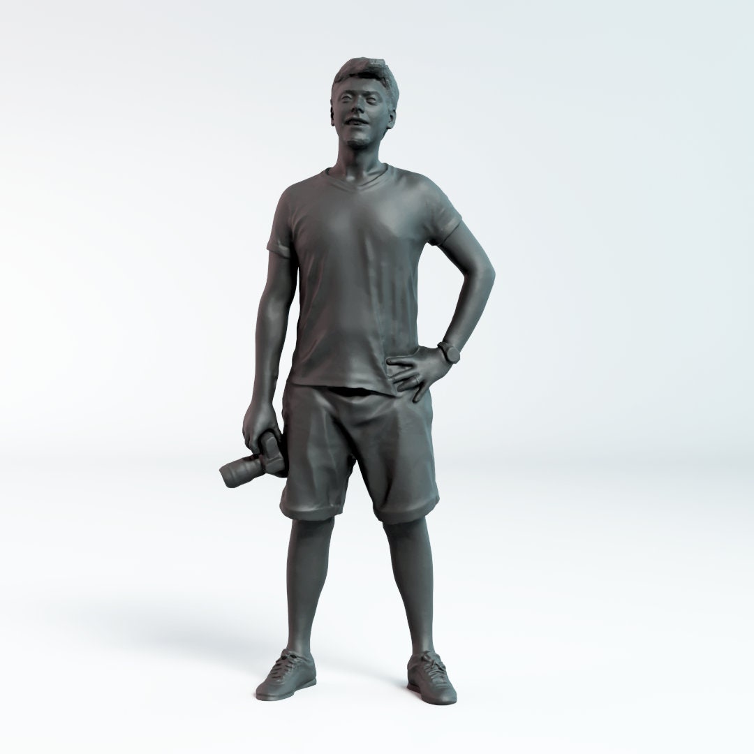 Miniature Young Man in Sporty Attire With Camera, Railway Model ...