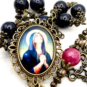 Our Lady of 7 Sorrows Marian, AAA Ruby Blue Sandstone Gemstone Tenner ...